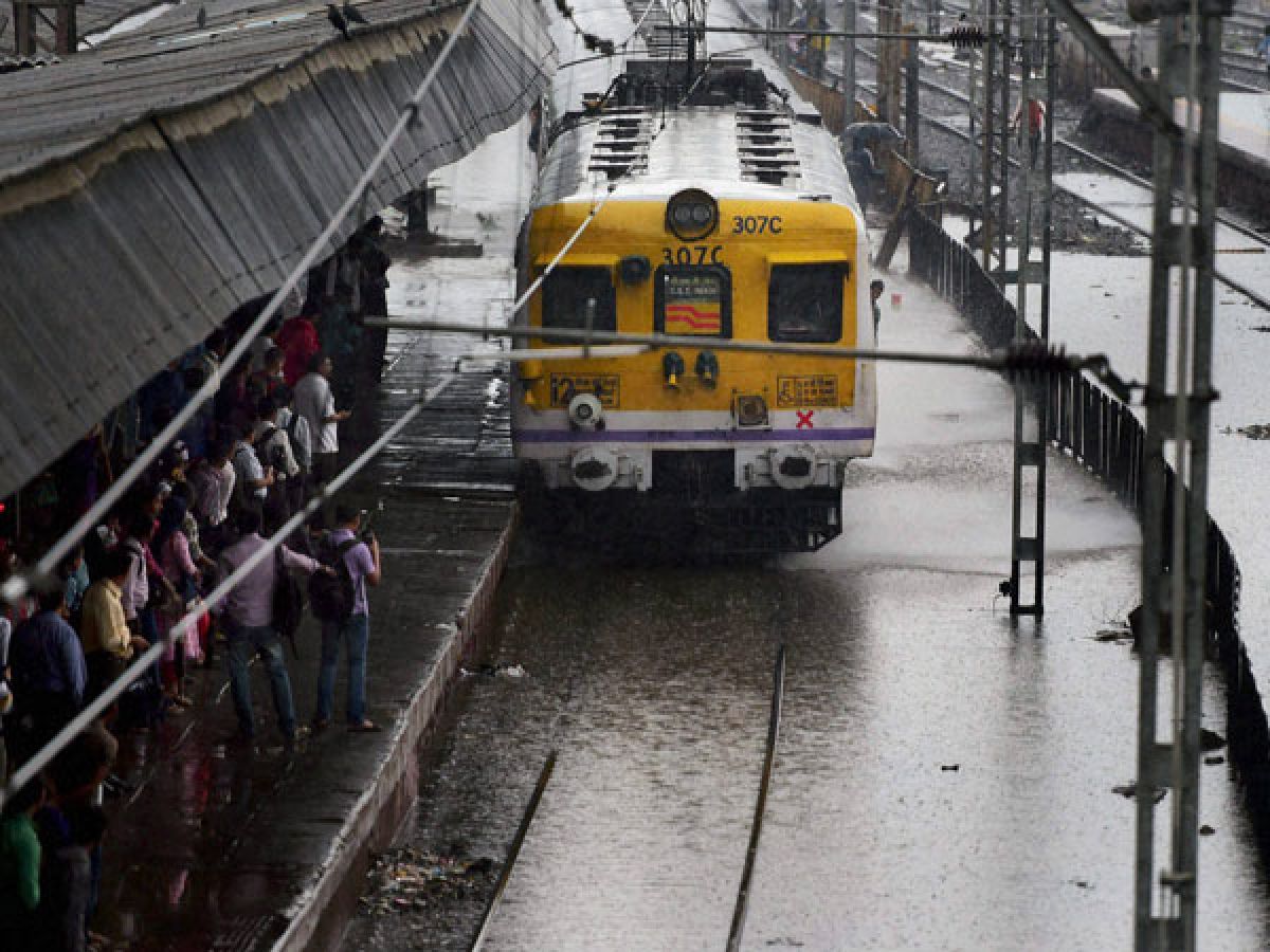 Monsoon reaches Mumbai; Heavy rains disrupt local train services ...