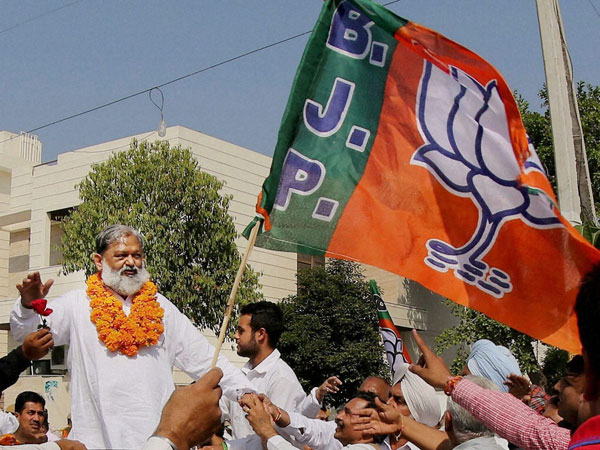 BJP workers celebrate party's thumping victory in Haryana, Maharashtra ...