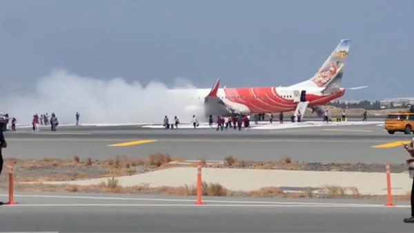 Air India Express flight catches fire at Muscat airport - Oneindia News
