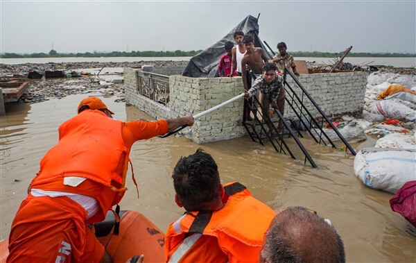 NDRF Personnel Rescue Residents From The Flood-affected Old Usmanpur Village, In New Delhi ...