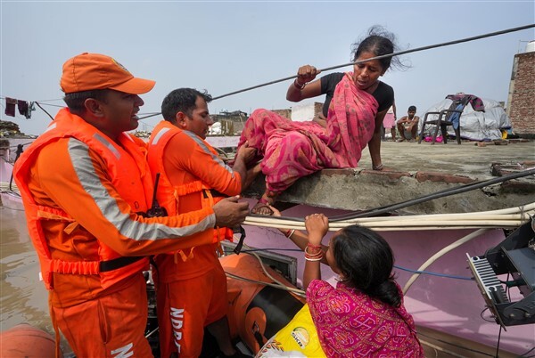 NDRF Personnel Rescue Residents From The Flood-affected Old Usmanpur Village, In New Delhi ...